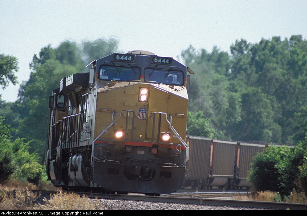 UP 6444, leads a loaded DPU Coal Train through the curve